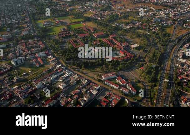 Aerial drone slowly approaches the Universidad de las Americas Puebla ...