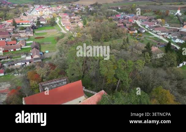 Panoramic drone shot of the Saxon fortified church in Apold, Romania. A ...
