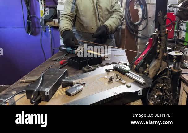 Arms of professional repairman prepare circular saw to grinding metal ...