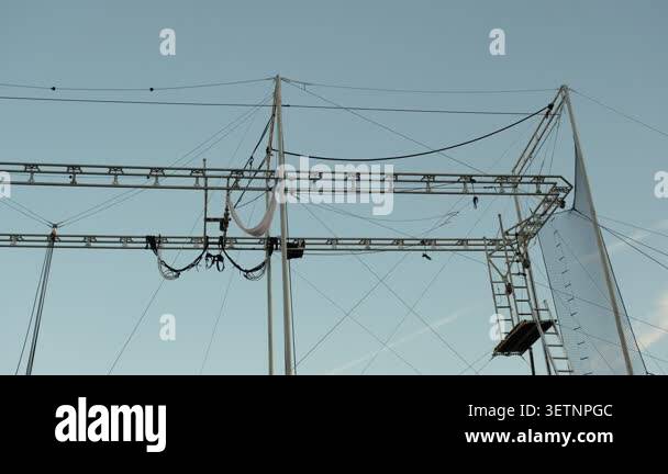 a full-size bar-to-bar flying trapeze rig used for circus arts training ...