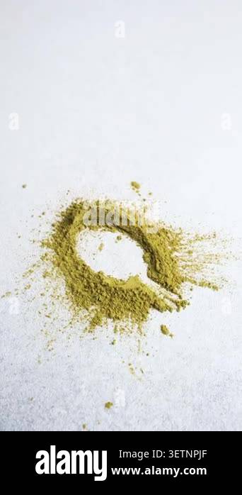 Powdered green tea spilled on a white surface Stock Video Footage - Alamy