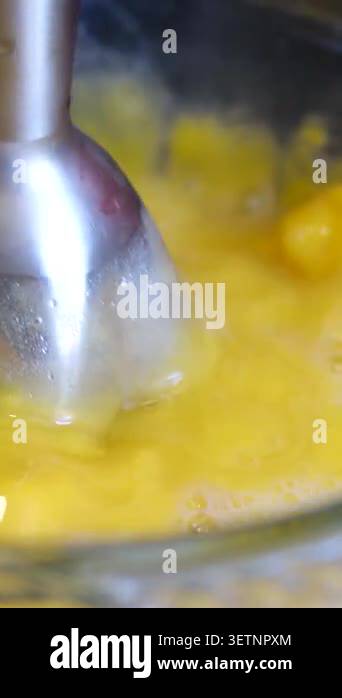 To make mango jelly, add gelatin to mango puree, blend with a blender ...