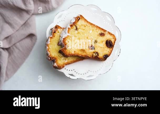 Slices of fruitcake on a white doily Stock Video Footage - Alamy