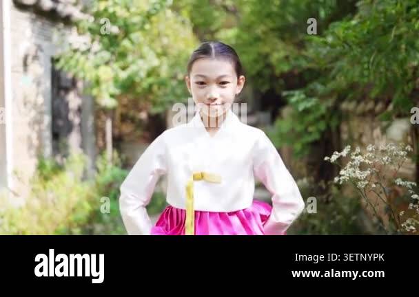 Young girl wearing traditional korean hanbok outdoors Stock Video ...