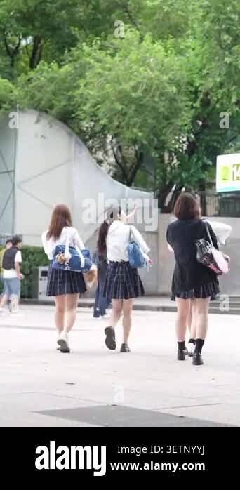 girls walking together in school uniforms Stock Video Footage - Alamy