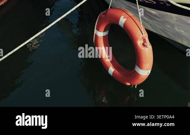 Life Buoy near the Boat on Pure Sea Water Stock Video Footage - Alamy