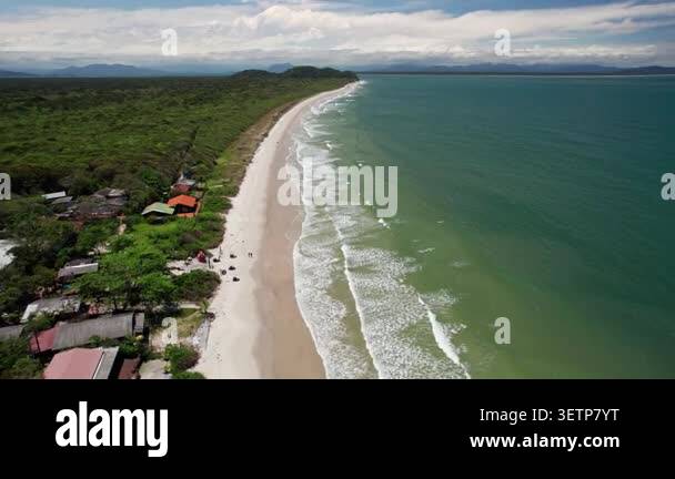 Aerial view of a beautiful sandy beach coastline with ocean waves and ...