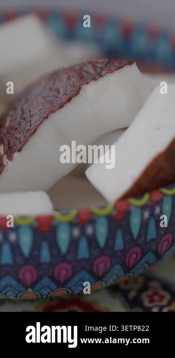 Slices of coconuts are served in a decorated bowl Stock Video Footage ...