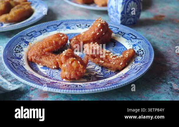 Food is ready with fried chicken wings on a blue plate with sauce Stock ...