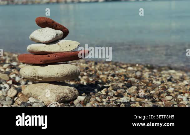 Small Stones Stacked on Top of Each Other by the Sea View Stock Video ...