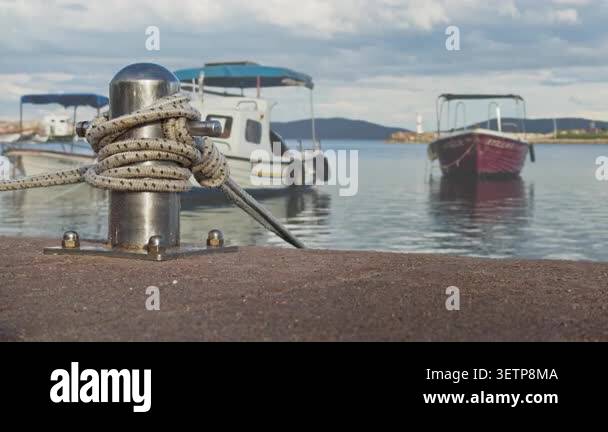 Old Anchor Rope Wrapped Around a Pier Mast in the Port Dock Stock Video ...