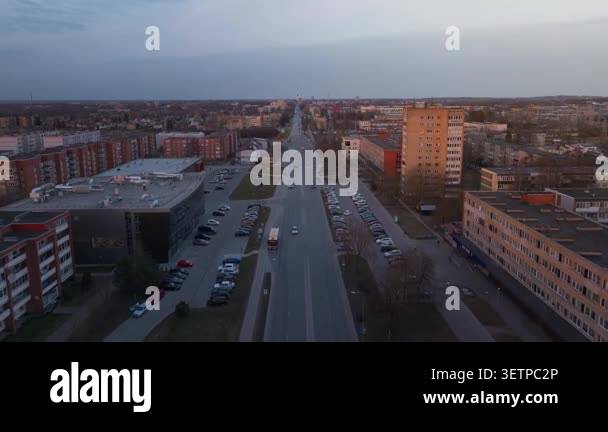 Aerial title Aerial boulevard in Lithuanian town with NORFA sign and ...