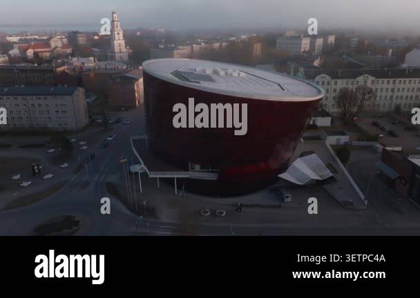 Aerial slow orbit shows Lielais Dzintars in Liepaja, Latvia, egg shaped ...