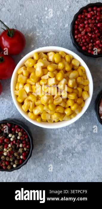 Golden, sweet canned corn kernels or maize for salads and vegetarian ...