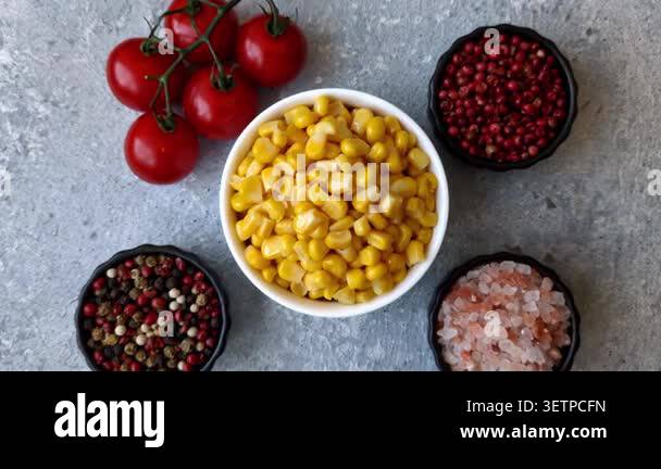Golden, sweet canned corn kernels or maize for salads and vegetarian ...