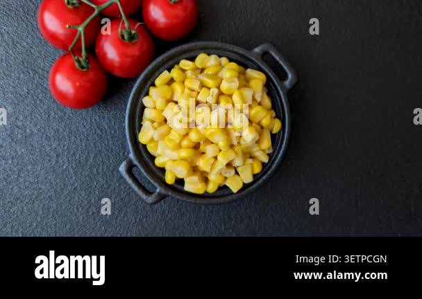 Golden, sweet canned corn kernels or maize for salads and vegetarian ...