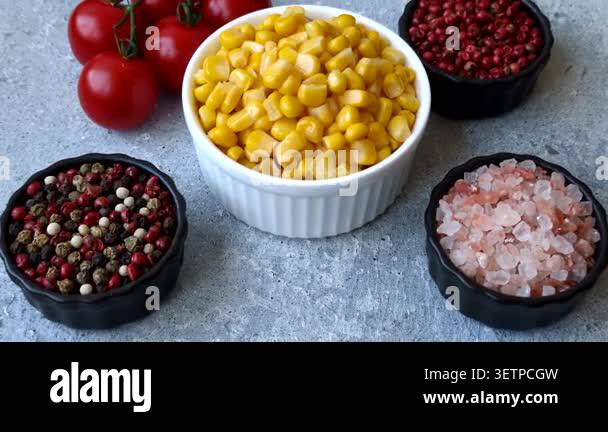 Golden, sweet canned corn kernels or maize for salads and vegetarian ...