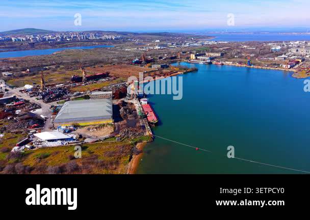 Industrial port area with scrap metal piles, Bulgaria. Wide drone view ...