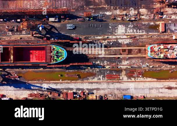 Top down view of a ship bow on a shipyard rail. Overhead drone angle ...