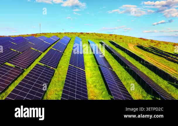 Perspective of solar panel arrays. Drone view looking up a vibrant ...