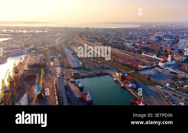 Sunset light over a port railway station and city, Burgas, Bulgaria ...