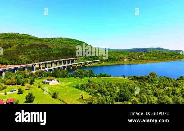 Railway bridge over reservoir, Bulgaria. Elevated angle of modern ...