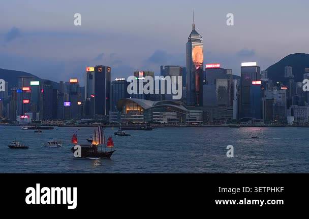 Stunning view of the iconic Aqua Luna red-sail junk boat crossing ...
