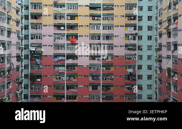 Facade of dense apartment buildings in Kowloon, Hong Kong, showcasing ...