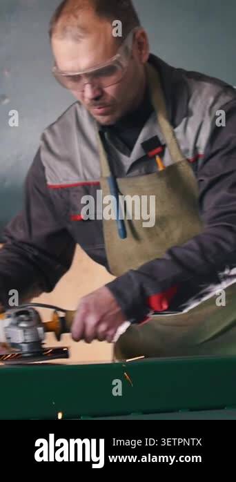 The worker grinding the steel mechanism on industry, slow-motion shot ...
