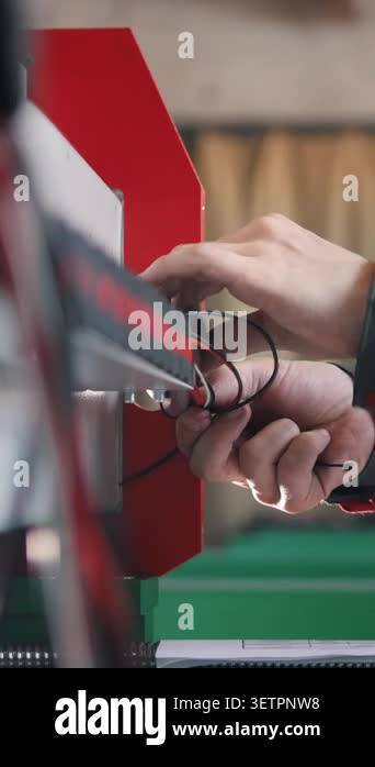 Hands of electrician engineer switching and testing equipment , close ...