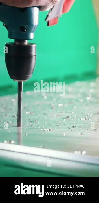 Industrial vacuum cleaner sucking up metal production waste, slow ...