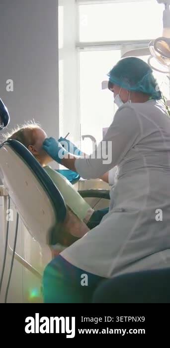 Little girl with mommy in dentist room, close up Stock Video Footage ...
