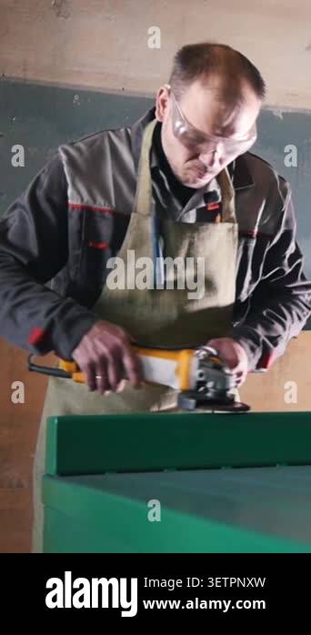 The worker male grinding the steel mechanism on industry, slow-motion ...