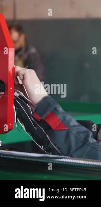 Portrait of electrician on overalls is working with energy panel and ...