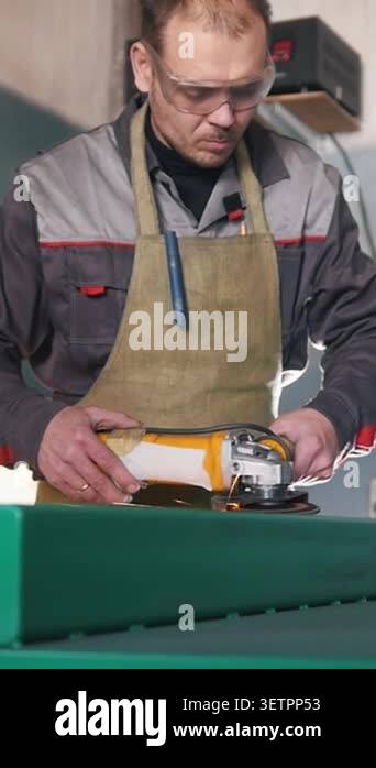 The worker grinding the steel mechanism on industry, slow-motion shot ...