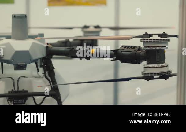 Modern multi-rotor agricultural drone with a tank for spraying ...
