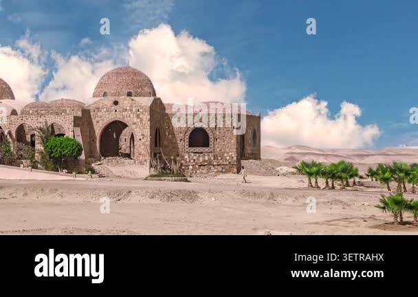 Timelapse video of an unfinished or abandoned stone building with domes ...