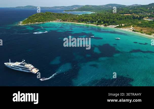 Wide aerial view of the unique Glarokavos lagoon and its sandy beach on ...