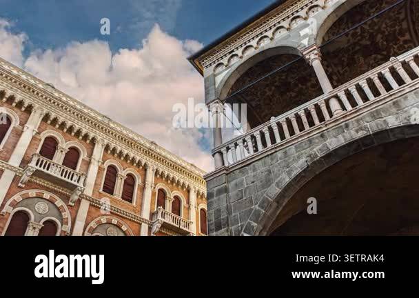 Low-angle view of two historical palaces in padua, italy, with dramatic ...