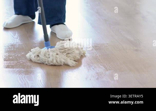 Home, spring cleaning and person with mop, floor or bucket with ...