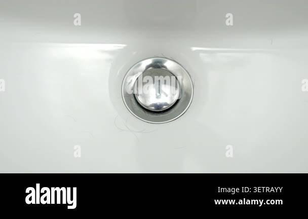 Feet and pile of hair loss in a bathroom after washing hair.Hair fall ...