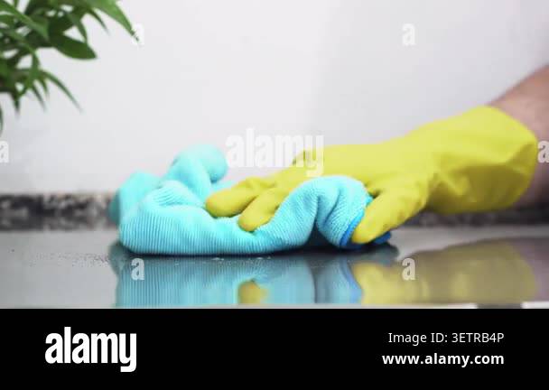 Hand, spray and a woman cleaning a metal surface in her home for ...