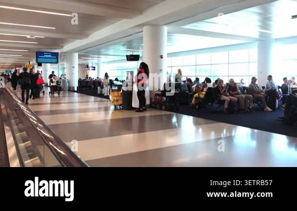 Beautiful view of travelers near gate B37 and moving walkway at JFK ...