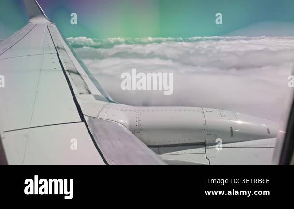Beautiful view of airplane wing above thick clouds seen through ...