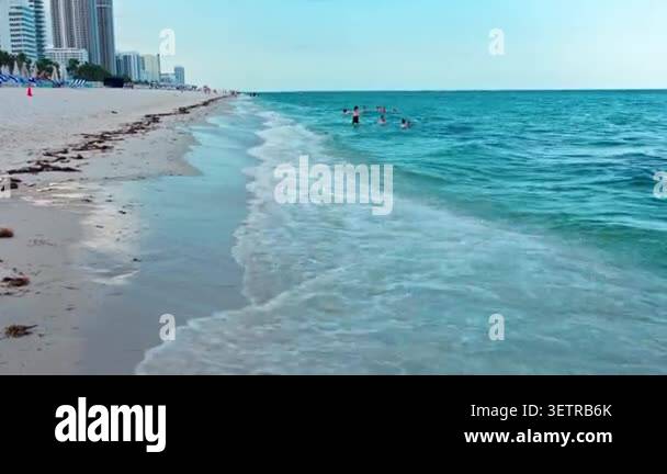 Beautiful view of turquoise Atlantic Ocean surf rolling onto sandy ...
