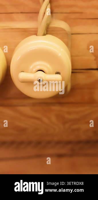 Vintage style light switches on wooden log wall interior detail. High ...