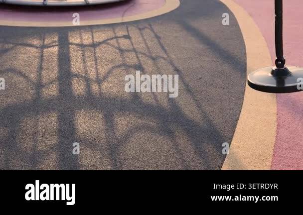 Round nest swing on sunny playground with empty seat and outdoor ...