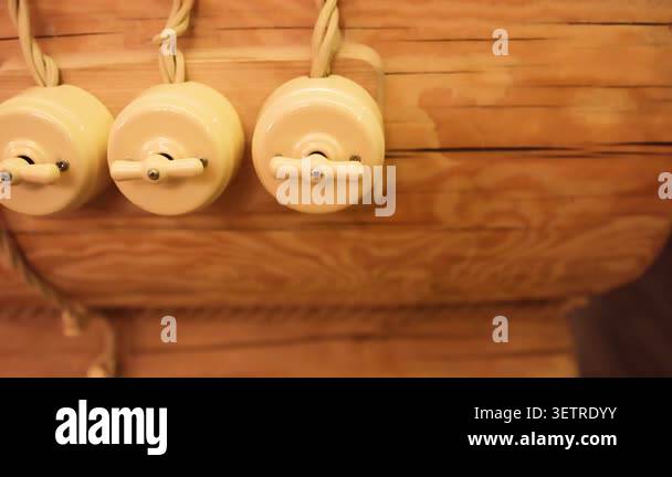 Retro light controls mounted on wooden log interior wall. High quality ...