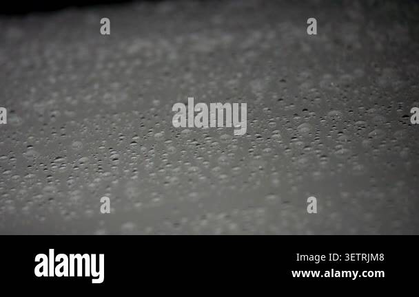 Tokyo, Japan - June 21, 2026: Raindrops falling on a Hood or a bonnet ...