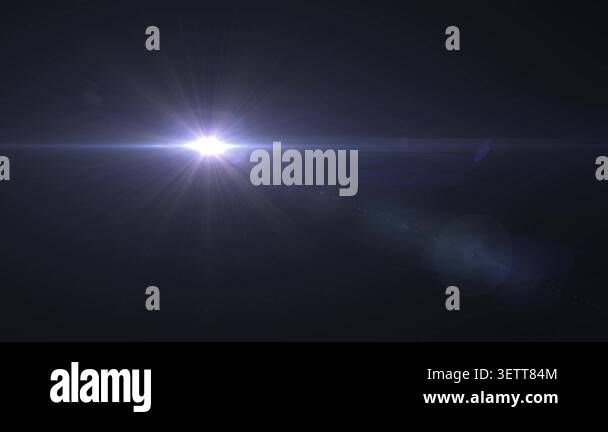 The sun illuminating a dark sky with a bright flare and lens flare ...